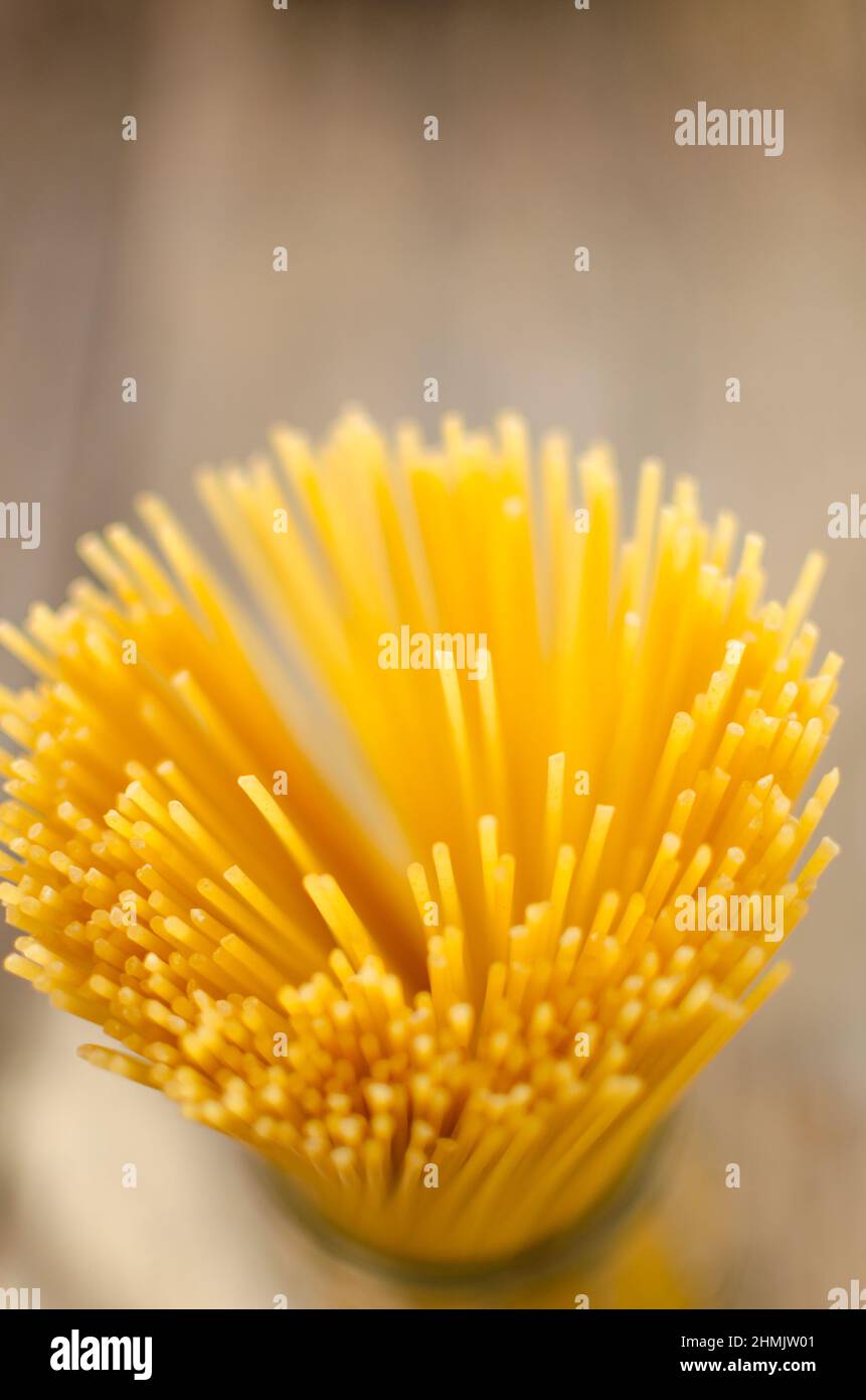 Uncooked spaghetti top view closeup vertical photo Stock Photo - Alamy