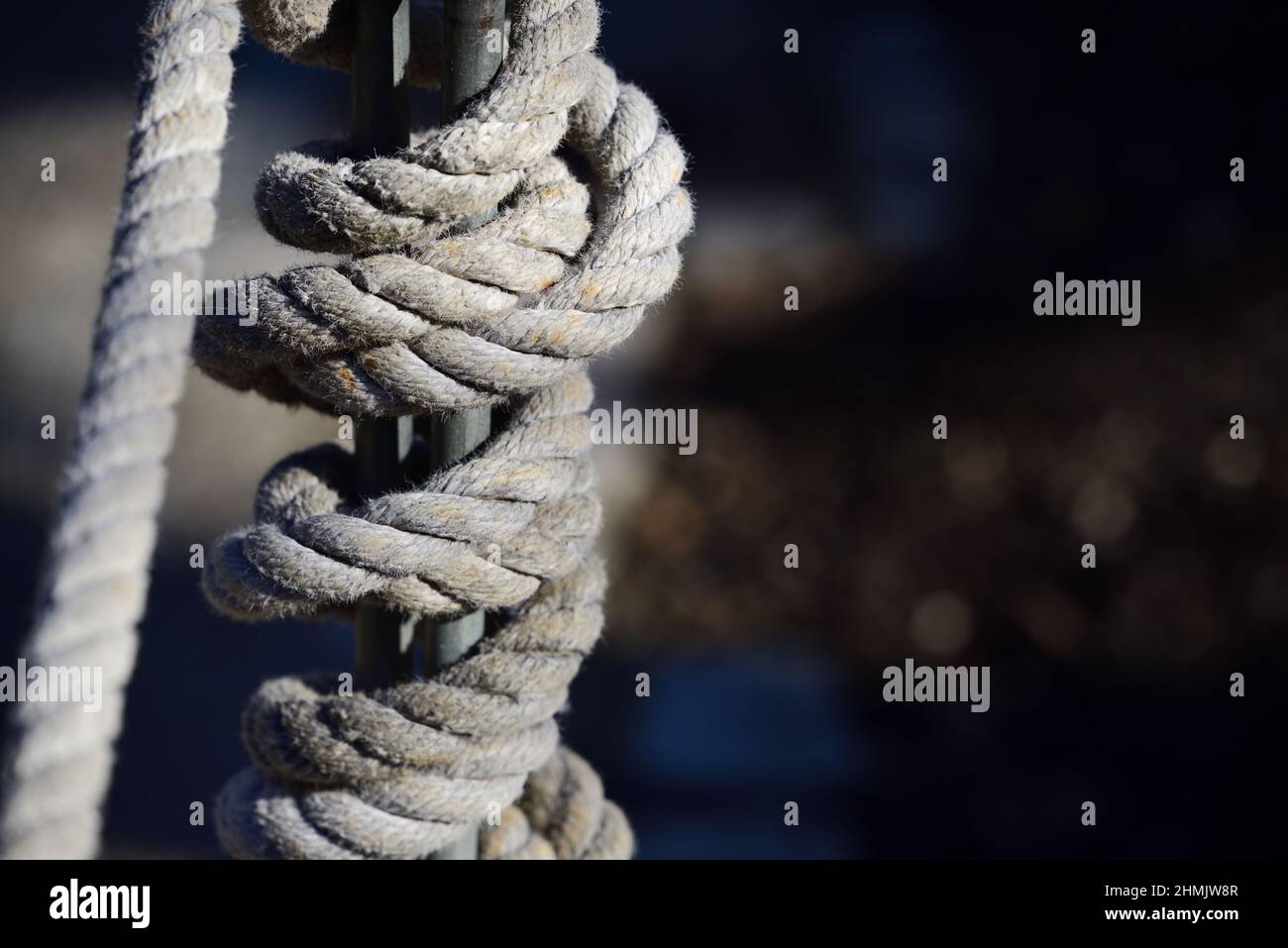 Old rope tied wooden pole hi-res stock photography and images - Alamy
