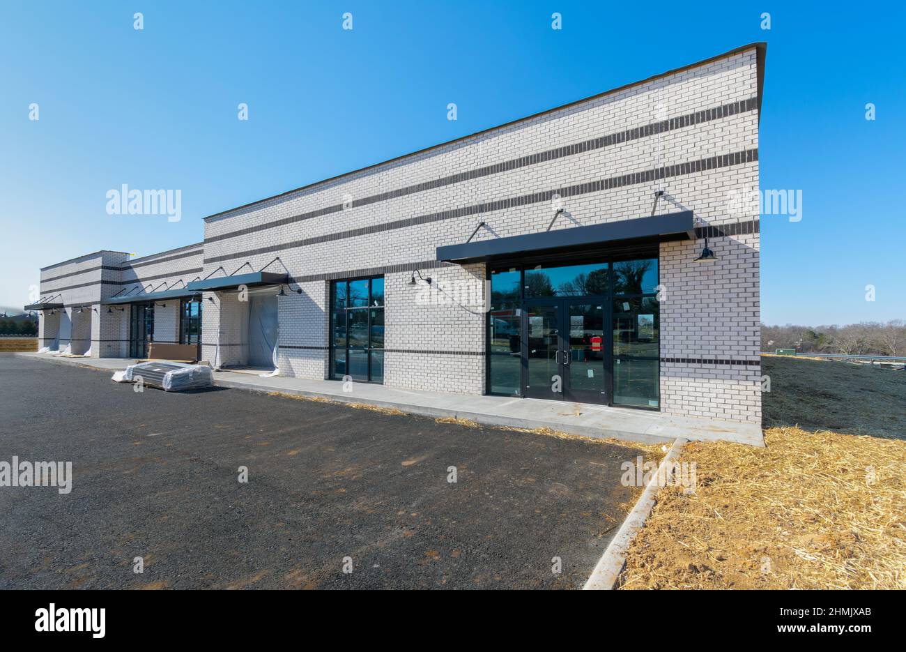 Horizontal shot of new retail construction on a small shopping center ...
