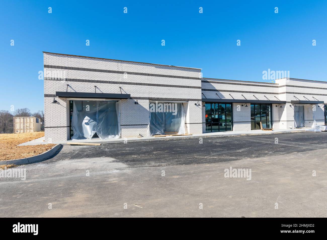 Horizontal shot of a new small commercial retail strip shopping center ...