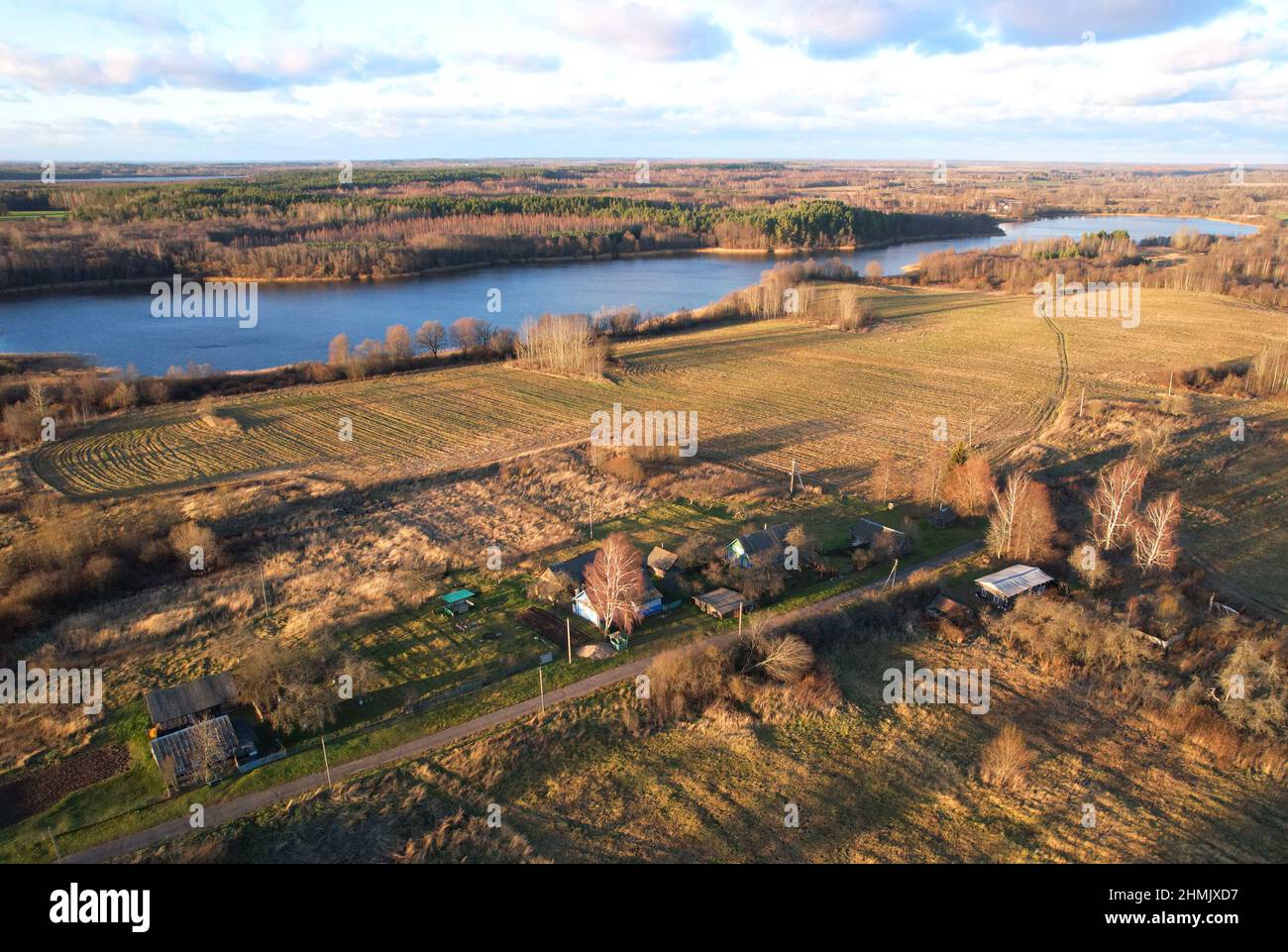 Wooden home in village at lake. Country houses in countryside. Suburban ...