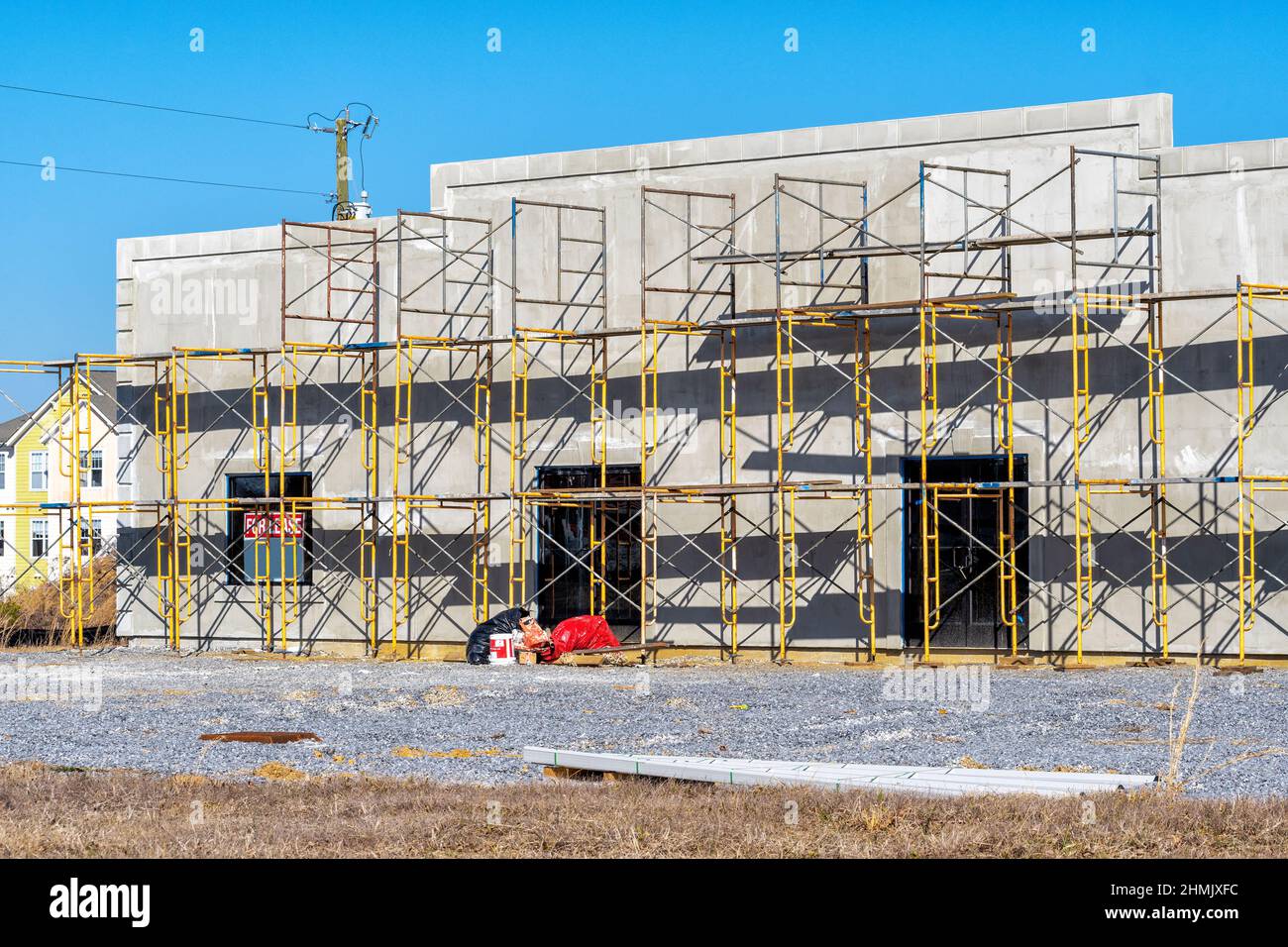 Horizontal shot of scaffolding across the front of new retail ...