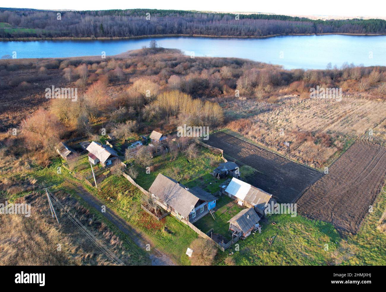 Wooden home in village at lake. Country houses in the countryside ...