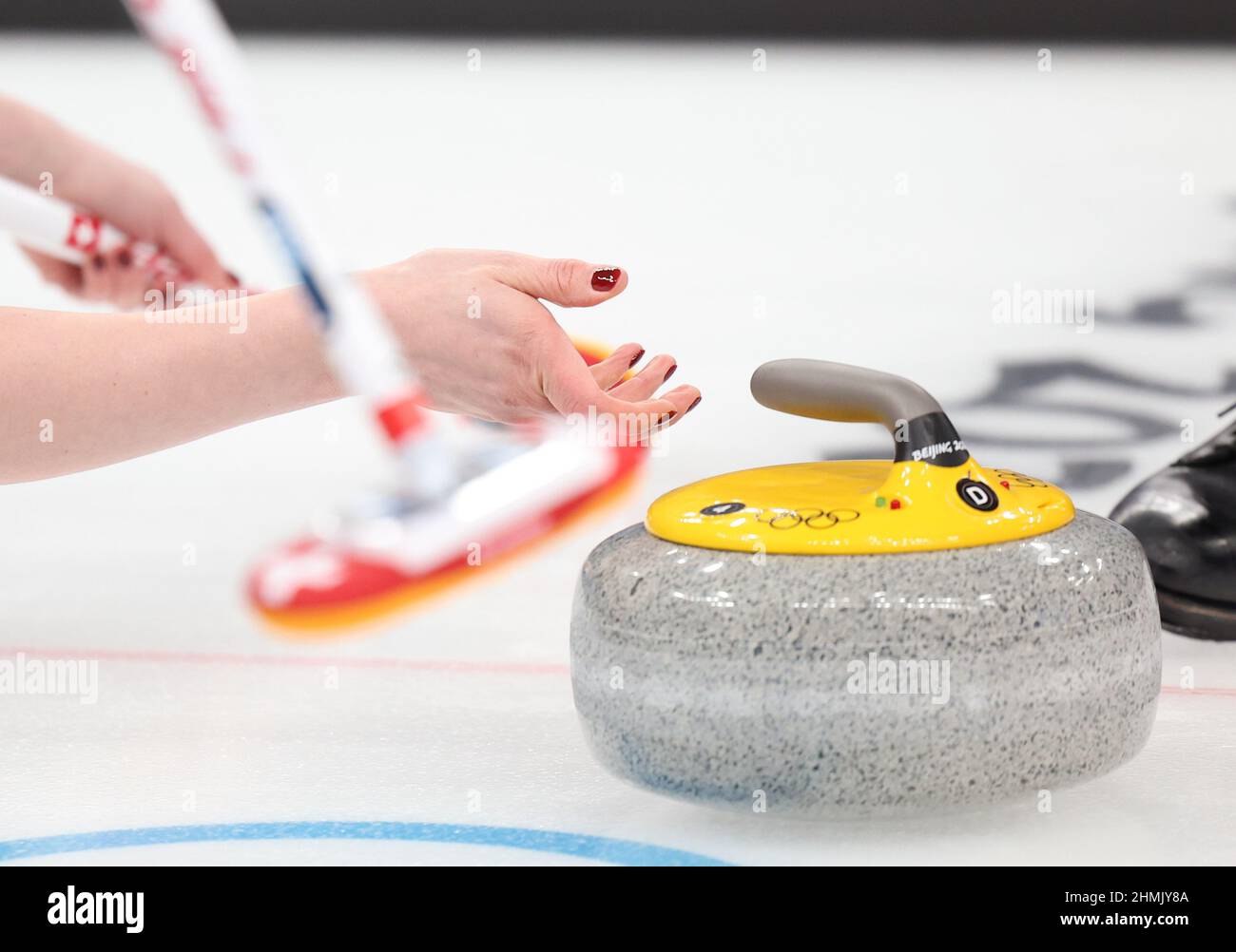 Beijing, China. 10th Feb, 2022. An athlete of Switzerland curls the ...