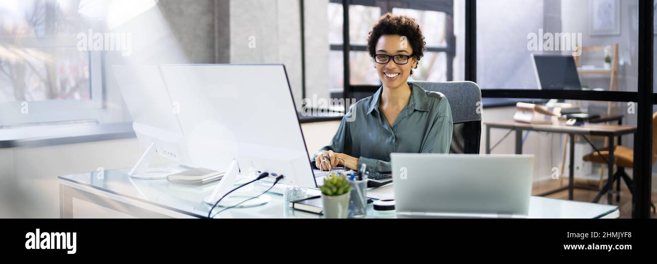 African Accountant Woman In Office Using Computer Stock Photo - Alamy
