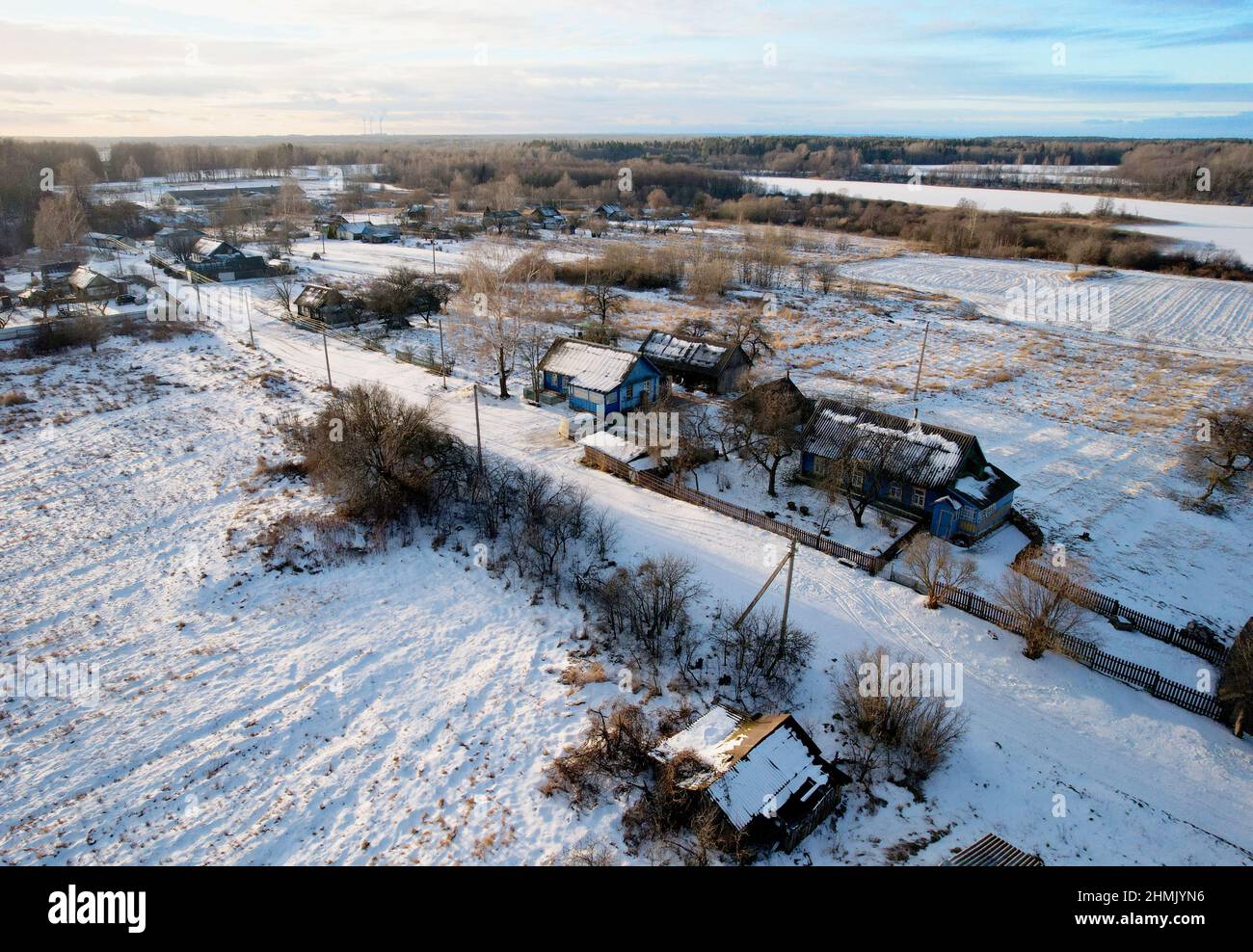 Wooden home in village in winter season. Country houses in countryside ...