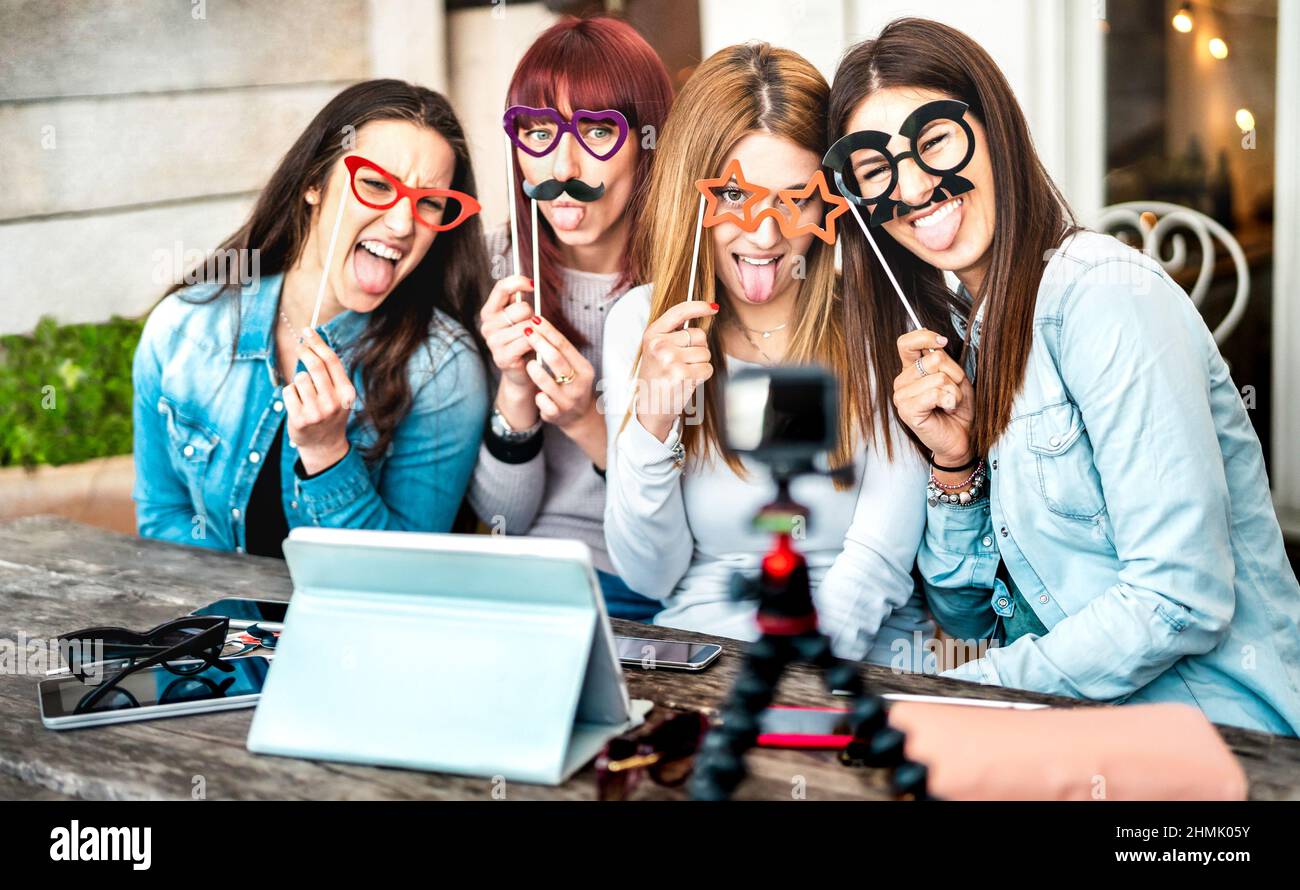 Funny milenial women having fun on stream platform through digital web ...