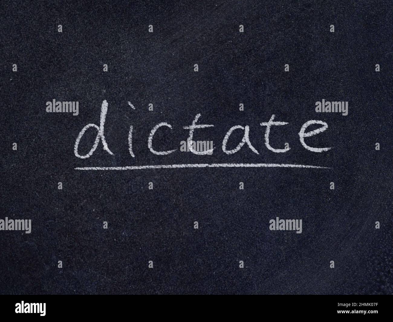 dictate concept word on blackboard background Stock Photo - Alamy