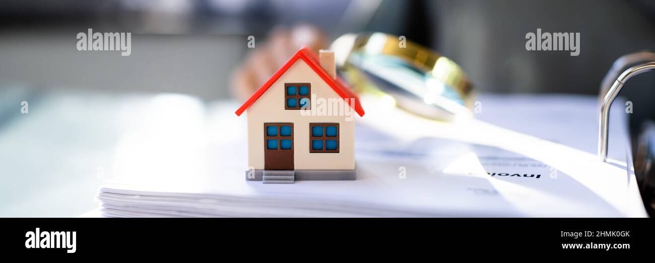 Real Estate House Inspector Checking Property Using Magnifying Glass ...