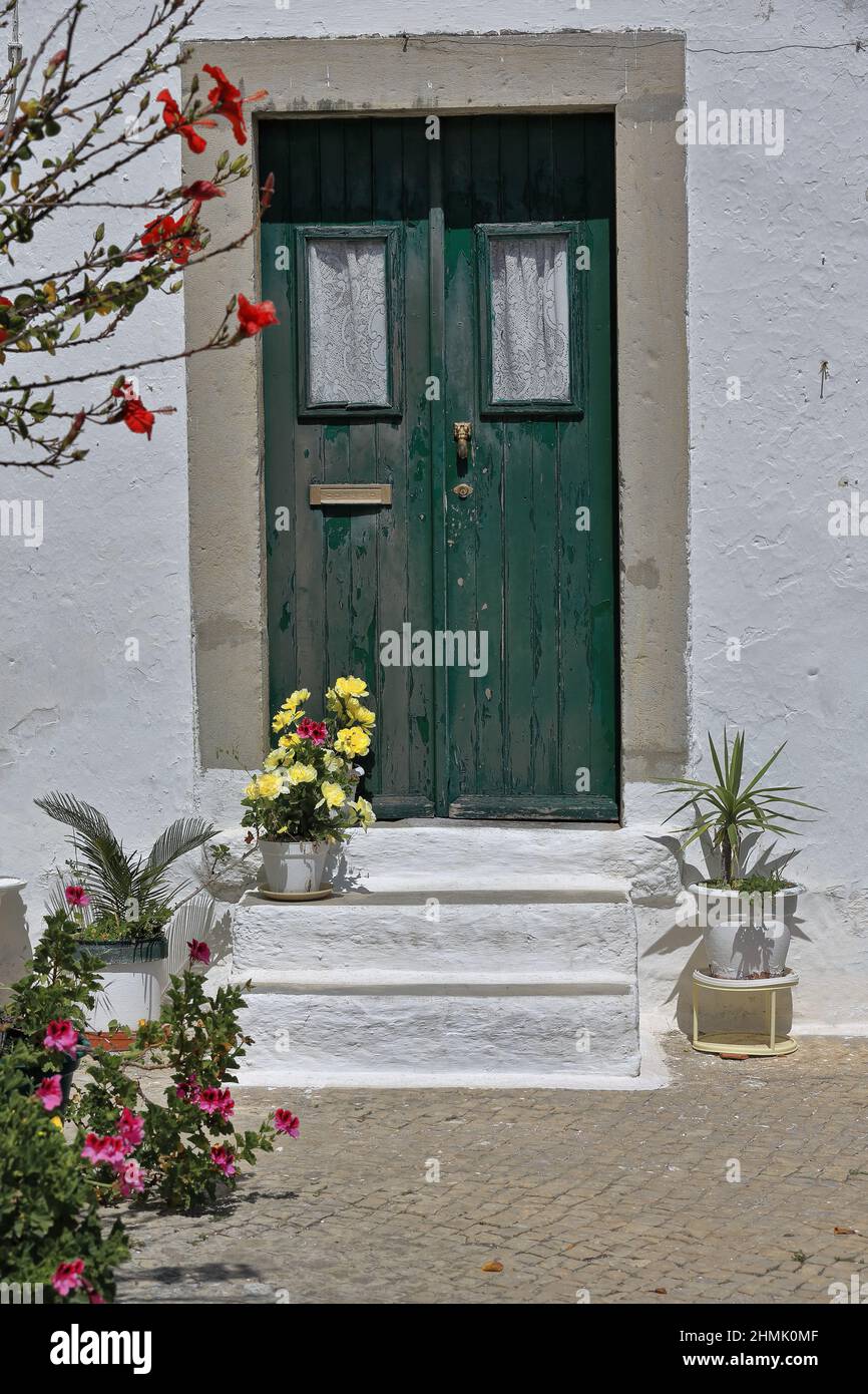 Green wood door-chipped paint-three doorsteps-Hermitage of Saint Blaise ...