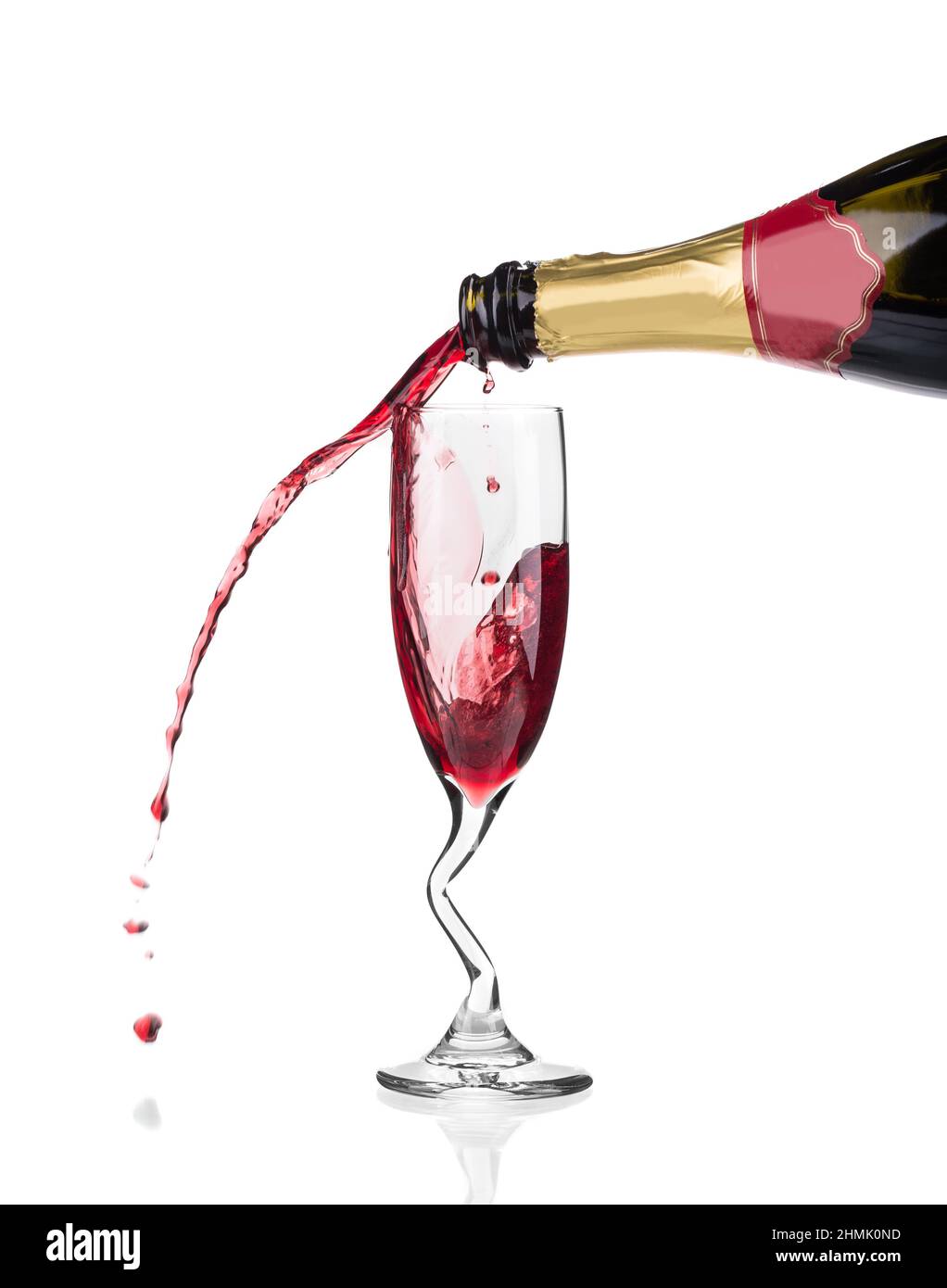 Pouring champagne in glass. Spill. Isolated on a white background Stock ...