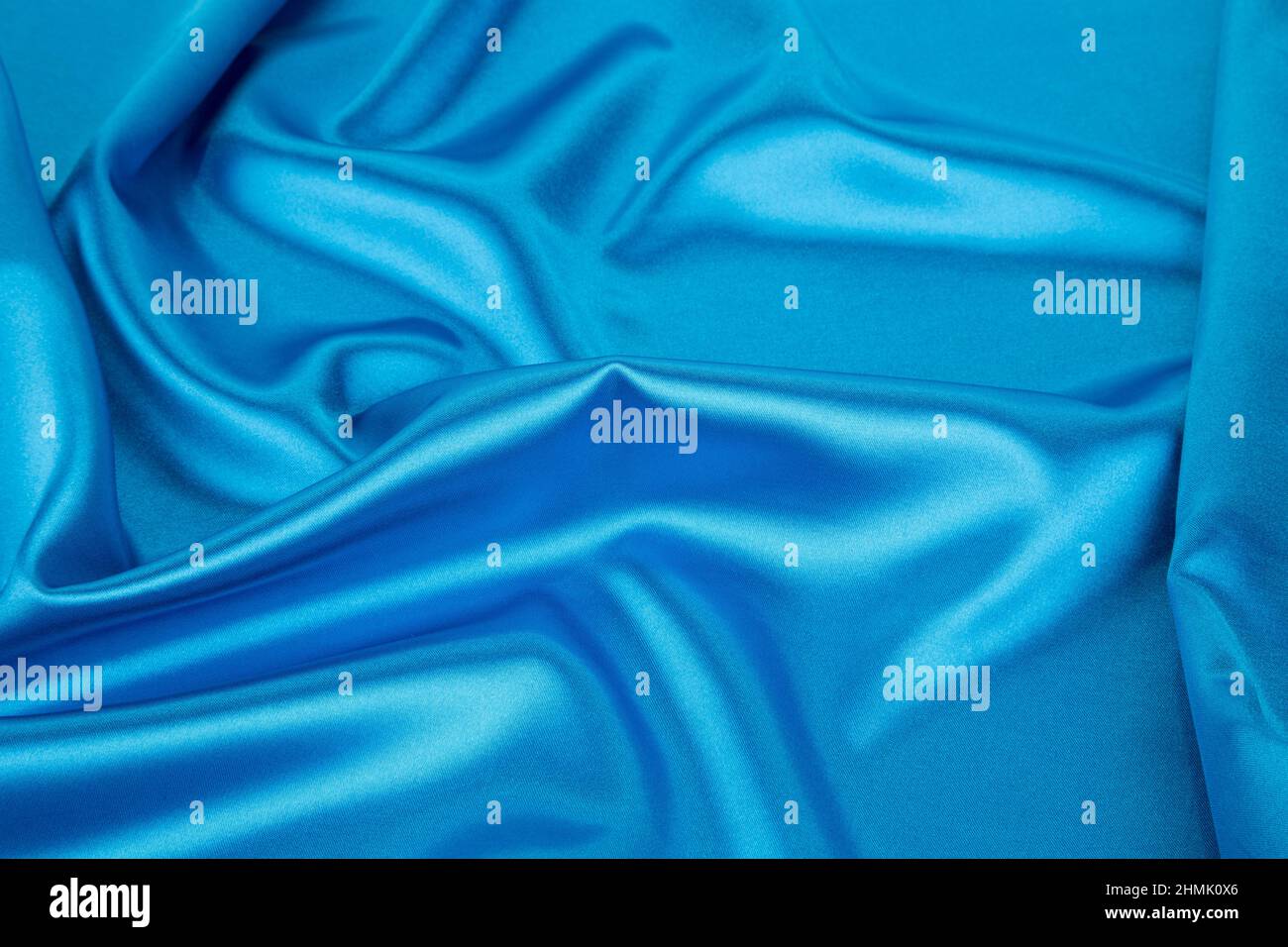 Blue silk cloth folds close up. Whole background Stock Photo - Alamy