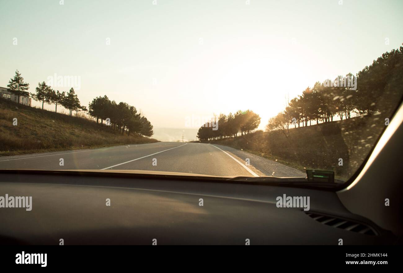 Sunny road from car window. Whole background Stock Photo - Alamy