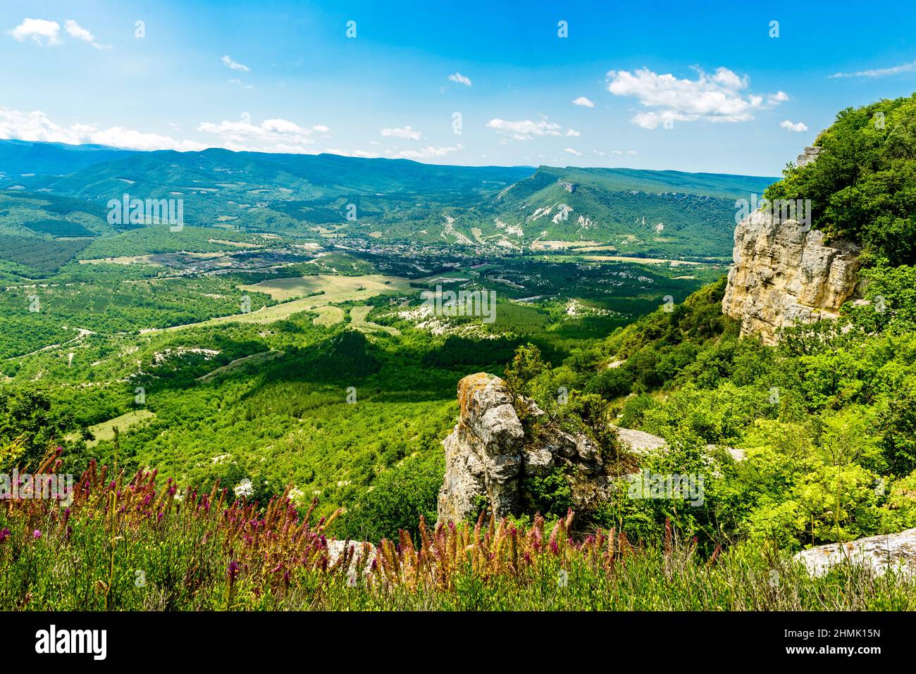 View of river valley in mountain. The rocky mountain surrounds the ...