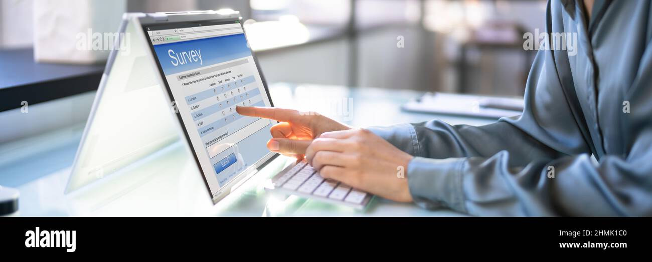 Black Woman Filling Online Survey Form On Screen Stock Photo - Alamy