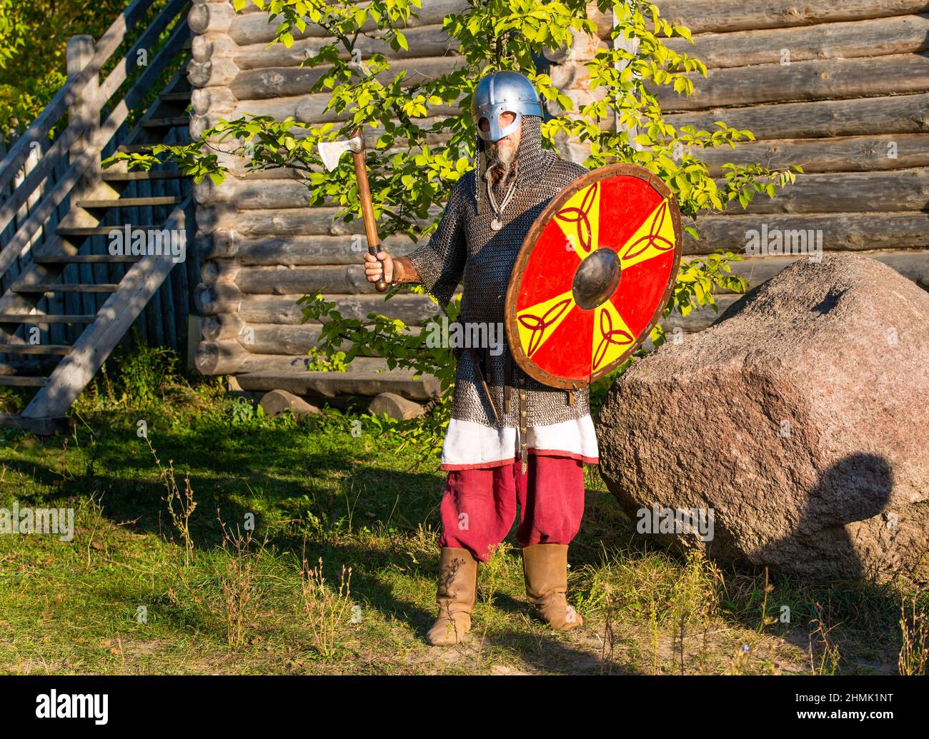Varangian in helmet. The varangian in the helmet stands with the axe ...