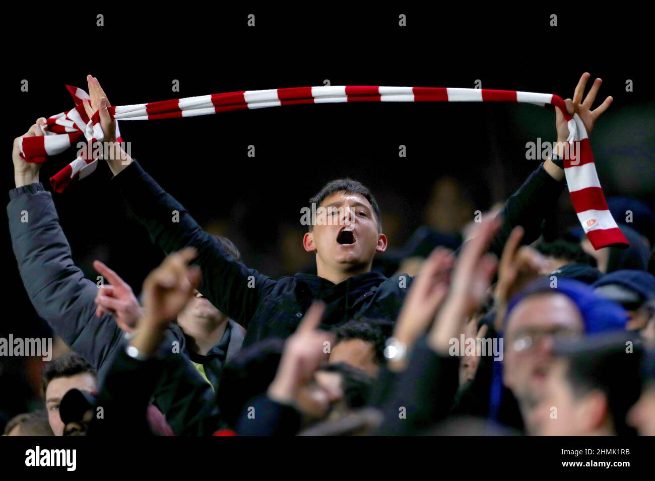 An arsenal fan celebrates in the stands hi-res stock photography and ...