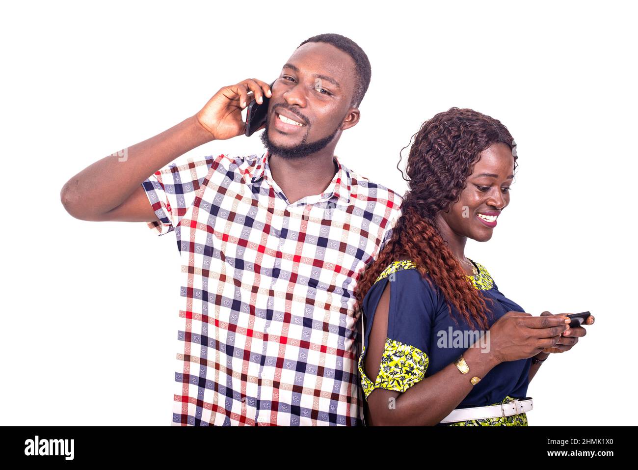 beautiful couple in love talking on mobile phone while woman using ...