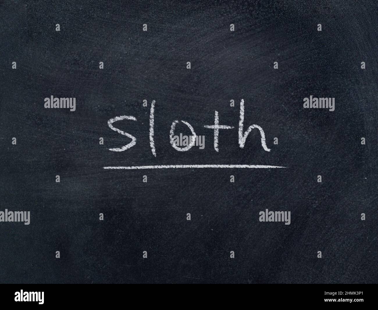 sloth concept word on blackboard background Stock Photo - Alamy