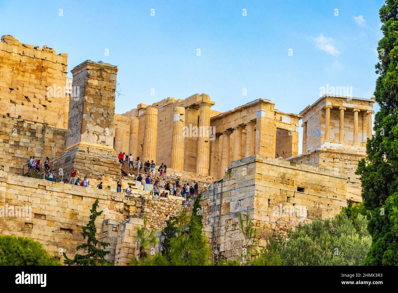 Acropolis of Athens on hill with amazing and beautiful ruins Parthenon and blue cloudy sky in ...