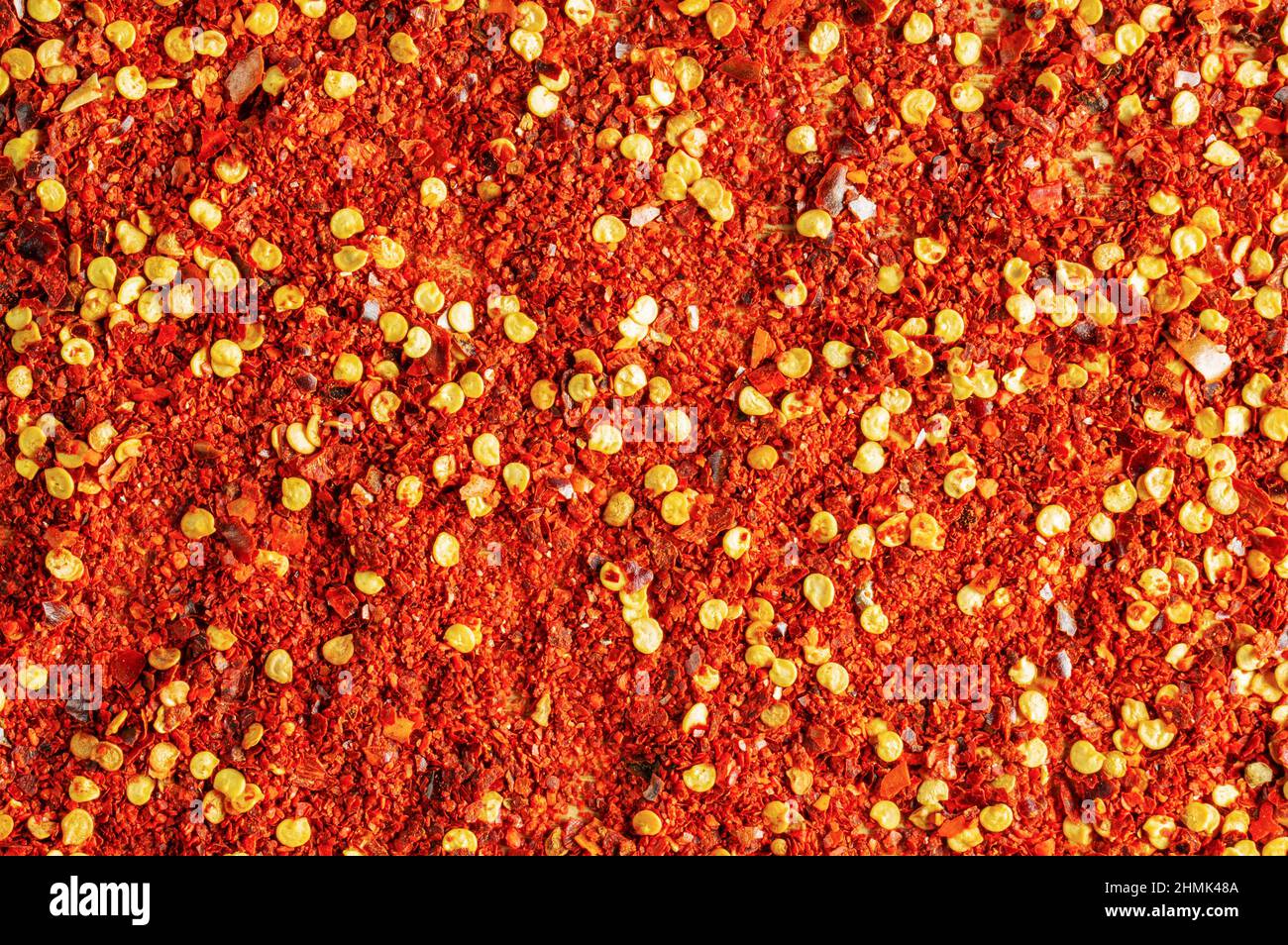 Dried red pepper powder. Background of crushed dry chili peppers. Top ...