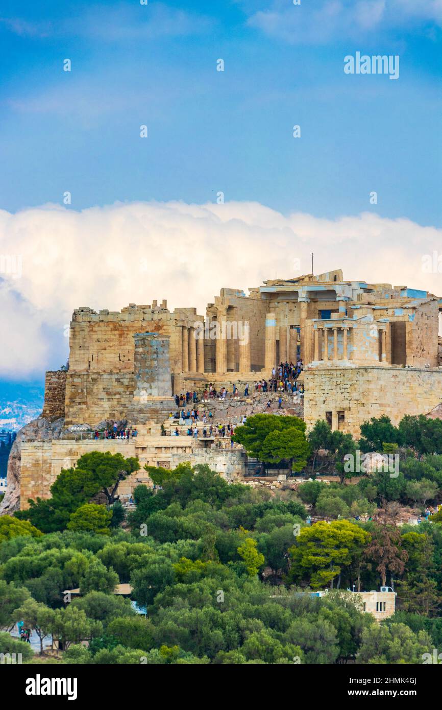 Acropolis of Athens on hill with amazing and beautiful ruins Parthenon and blue cloudy sky in ...