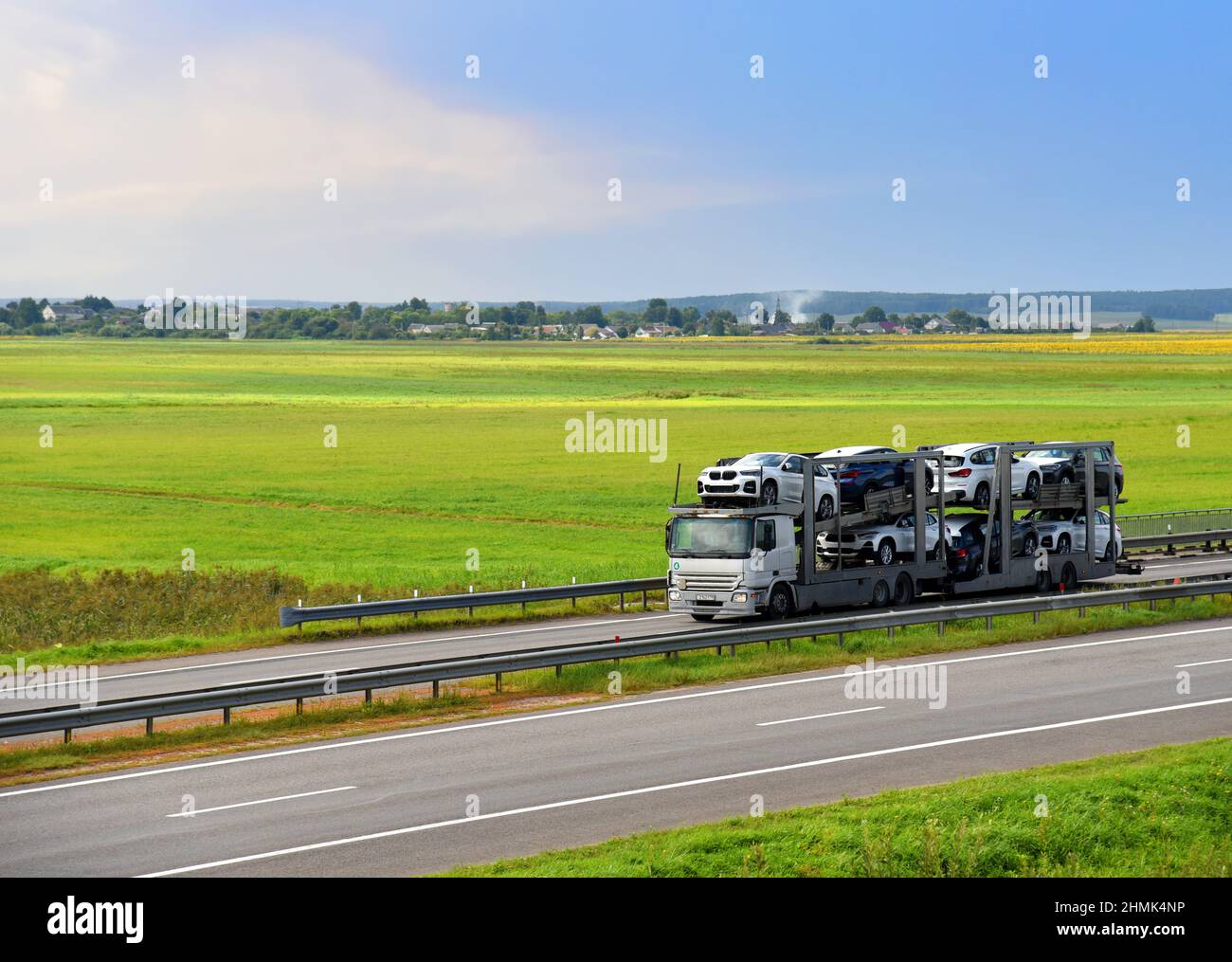 Car carrier trailer transports cars on highway. Auto transport and car ...