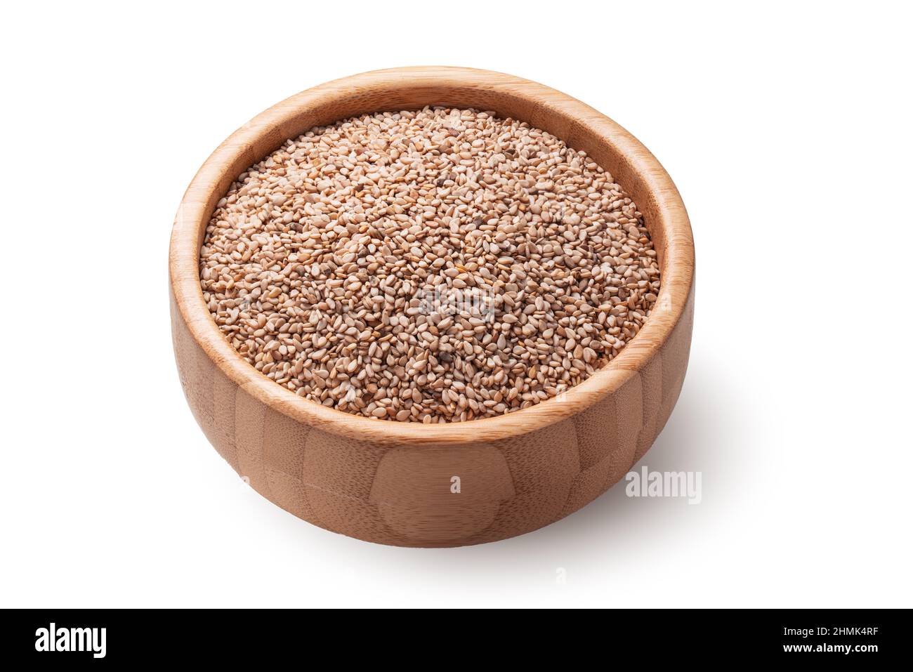 Unbleached Sesame Seeds in wooden bowl isolated on white background ...
