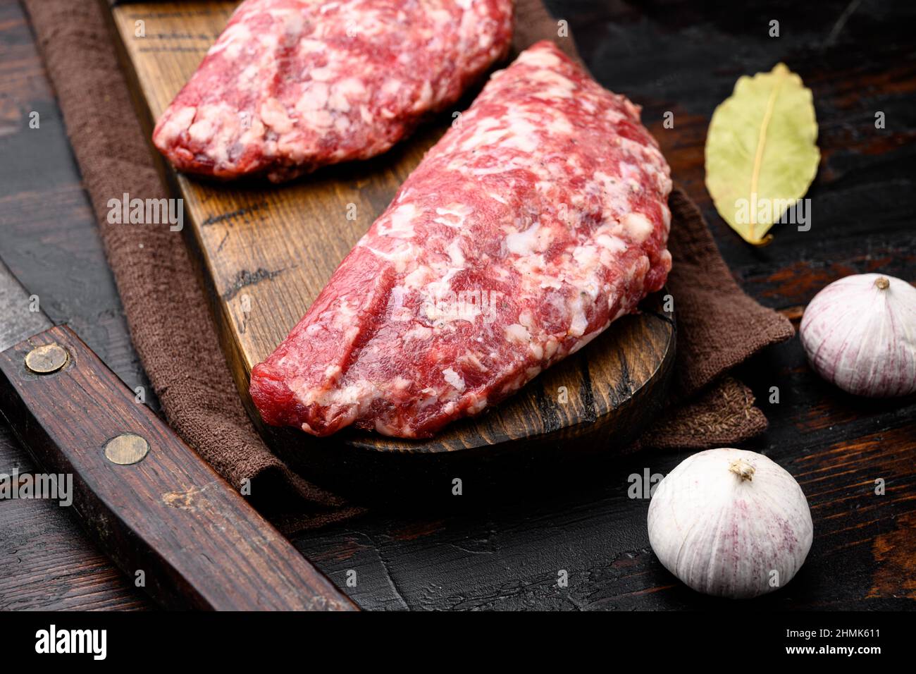 Uncooked minced meat beef burger cutlets set, on old dark wooden table ...