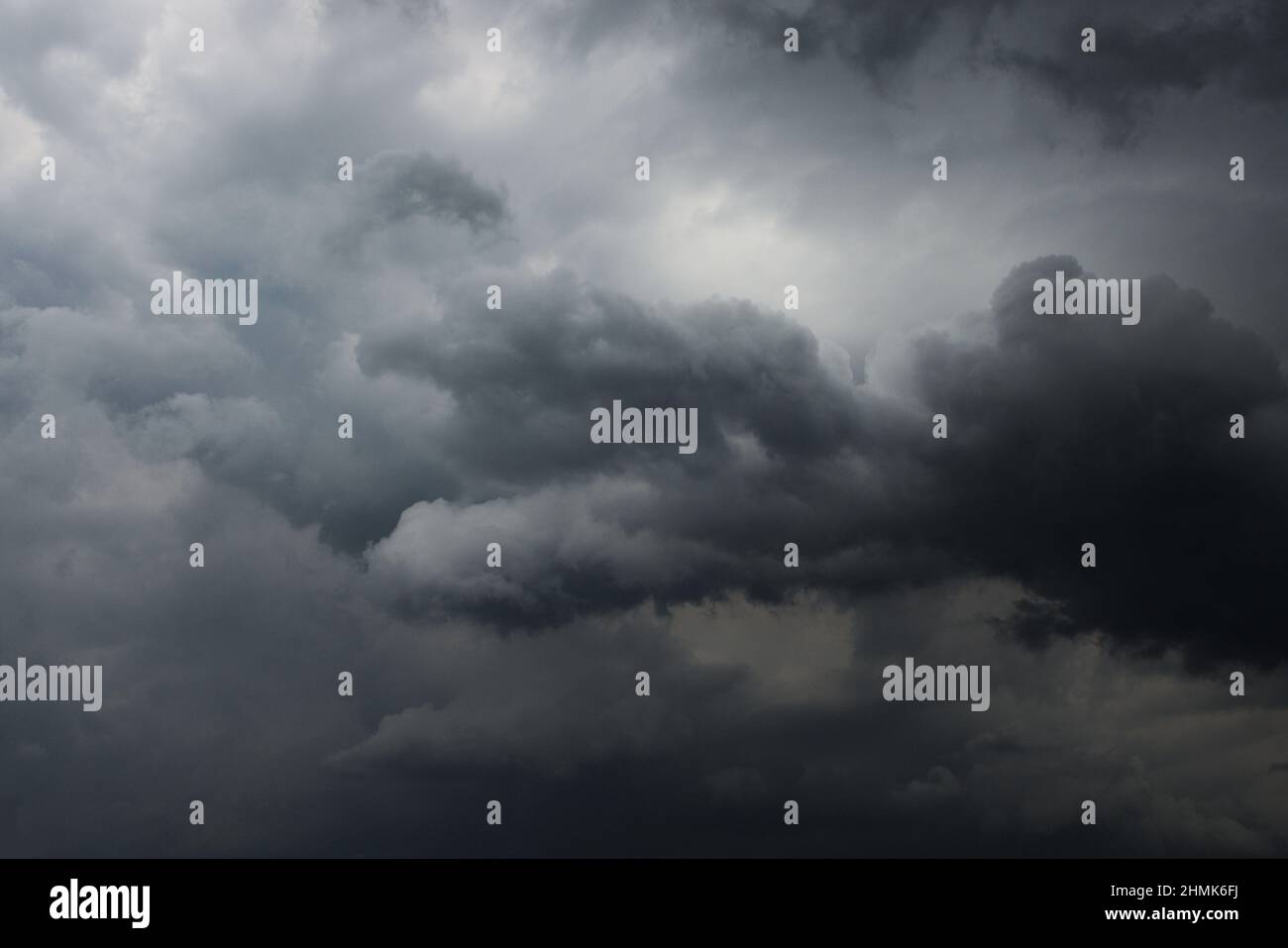 The sky is covered with dark, rainy clouds. Their dark, ominous color ...