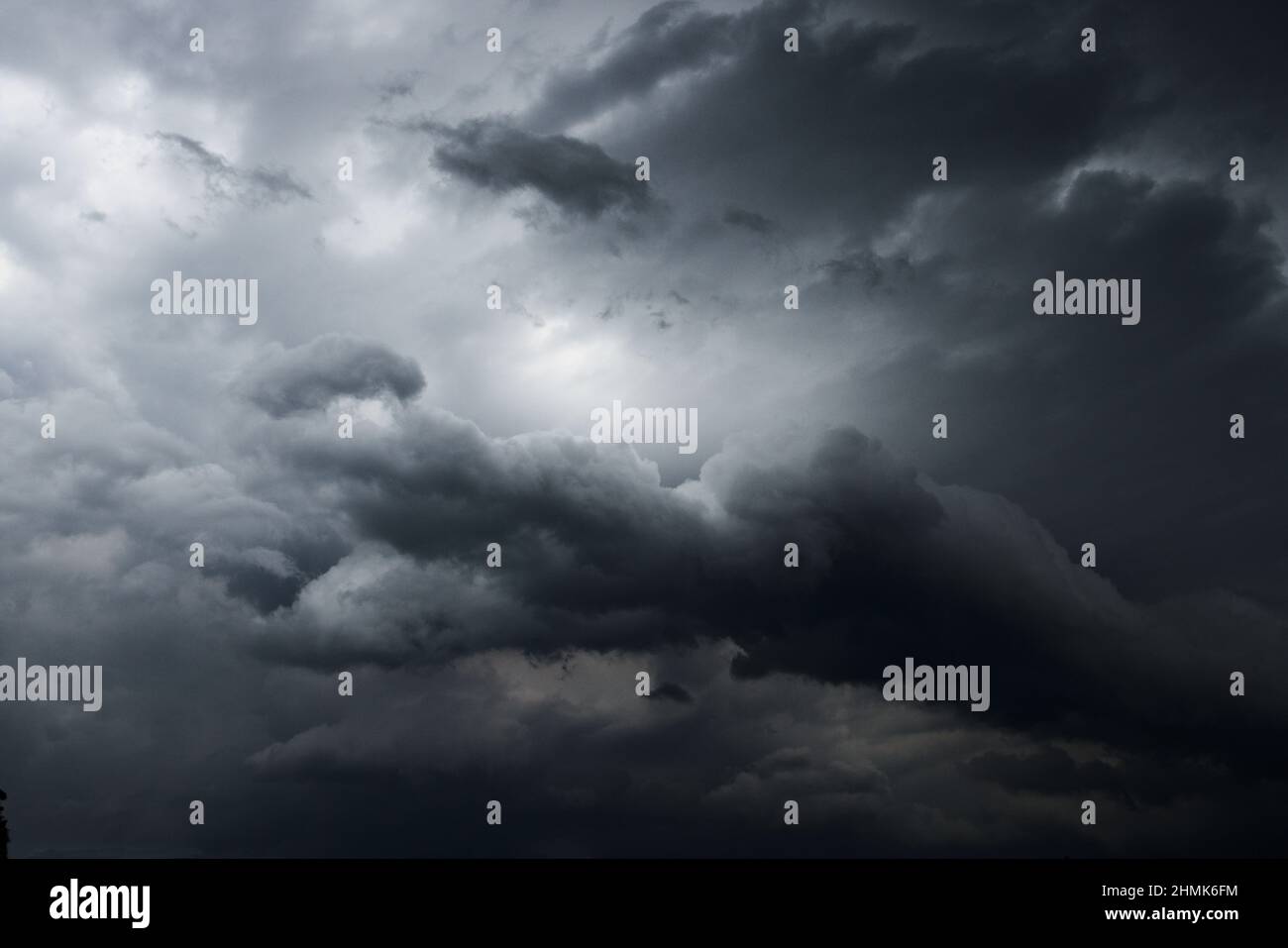 The sky is covered with dark, rainy clouds. Their dark, ominous color ...