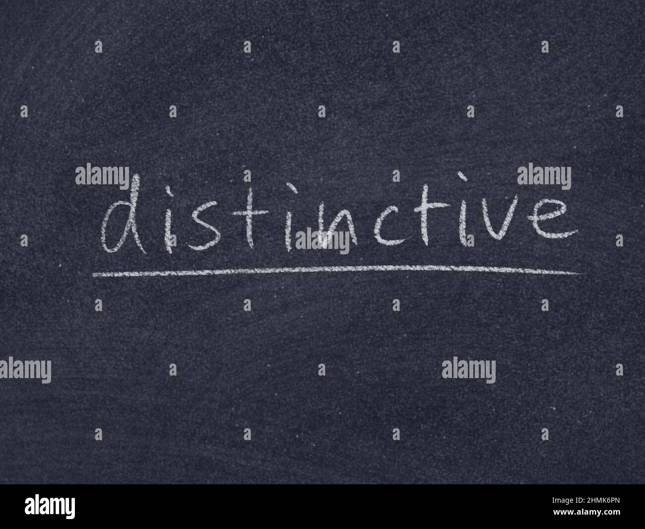 distinctive concept word on blackboard background Stock Photo - Alamy