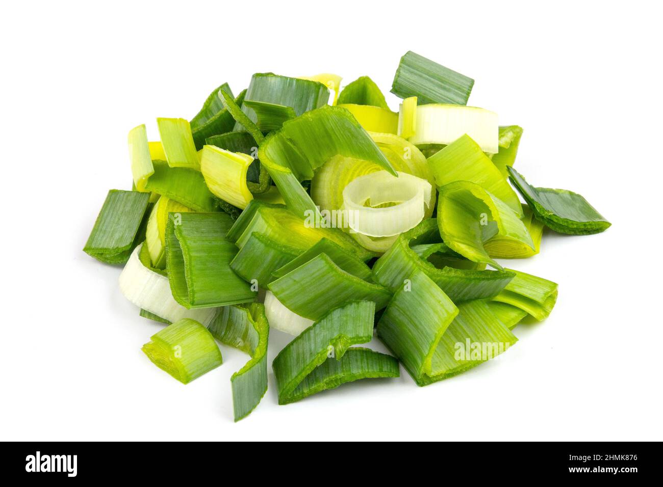 sliced leeks on white background Stock Photo - Alamy