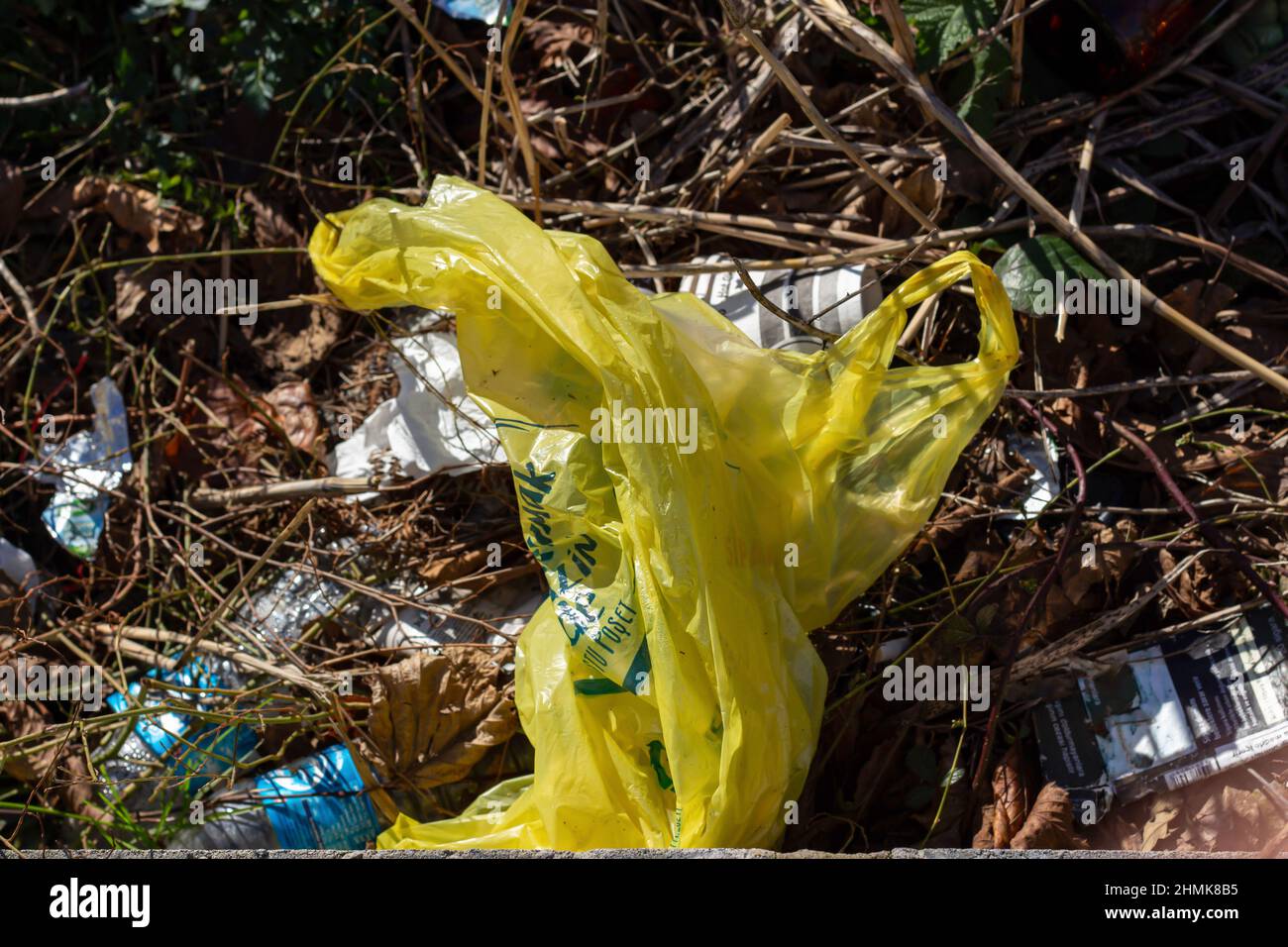Plastic trash in nature. Concept of Water bottle and plastic bag waste ...