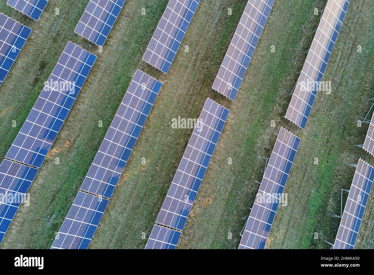 Aerial view of large sustainable electrical power plant with rows of ...