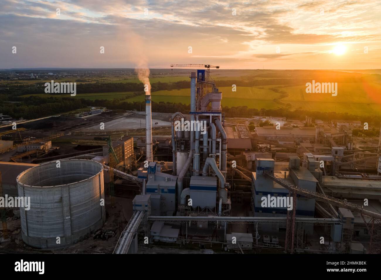 Aerial view of cement factory tower with high concrete plant structure ...