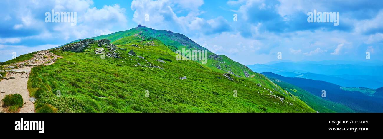 The peak of Pip Ivan Mount of Chornohora Range is surrounded with white ...