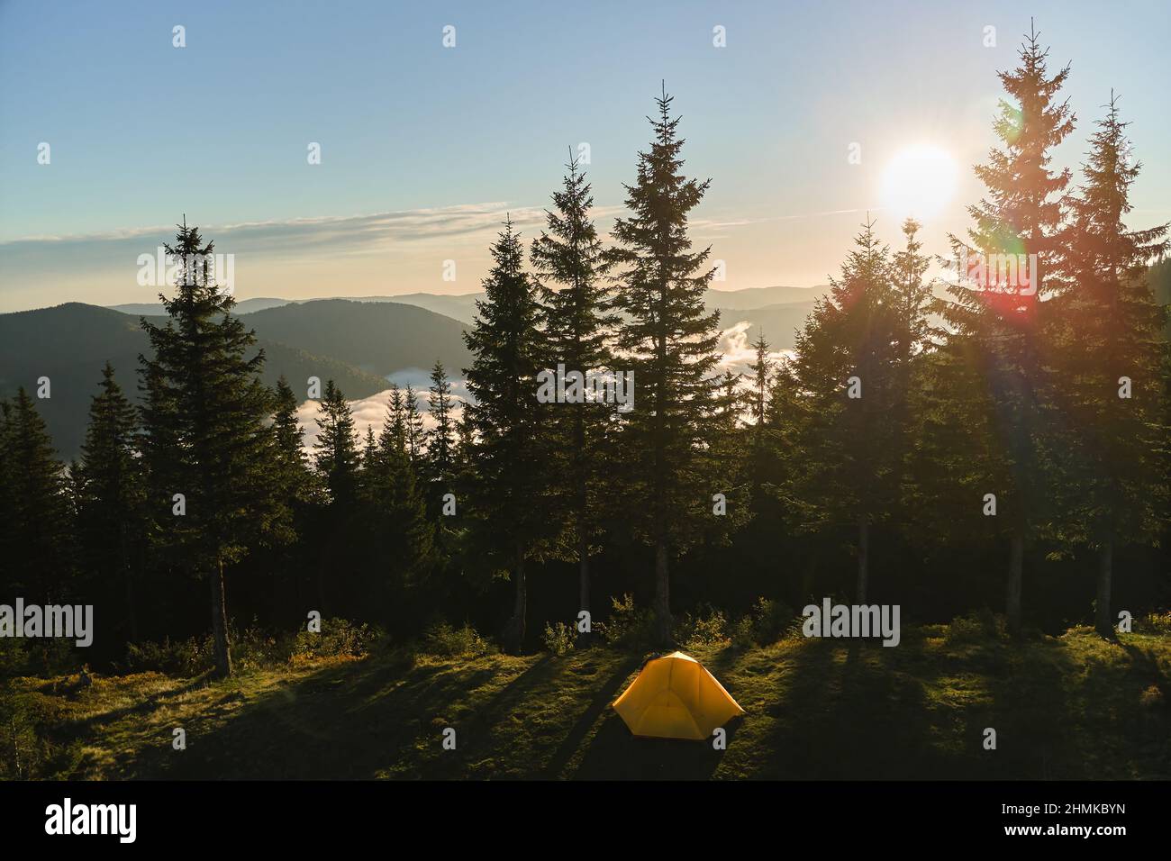 Aerial view of tourist camping tent on mountain campsite at bright ...