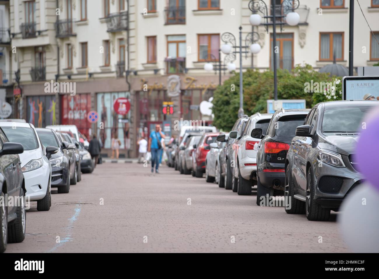 Cars parked in line on city street side. Urban traffic concept Stock ...