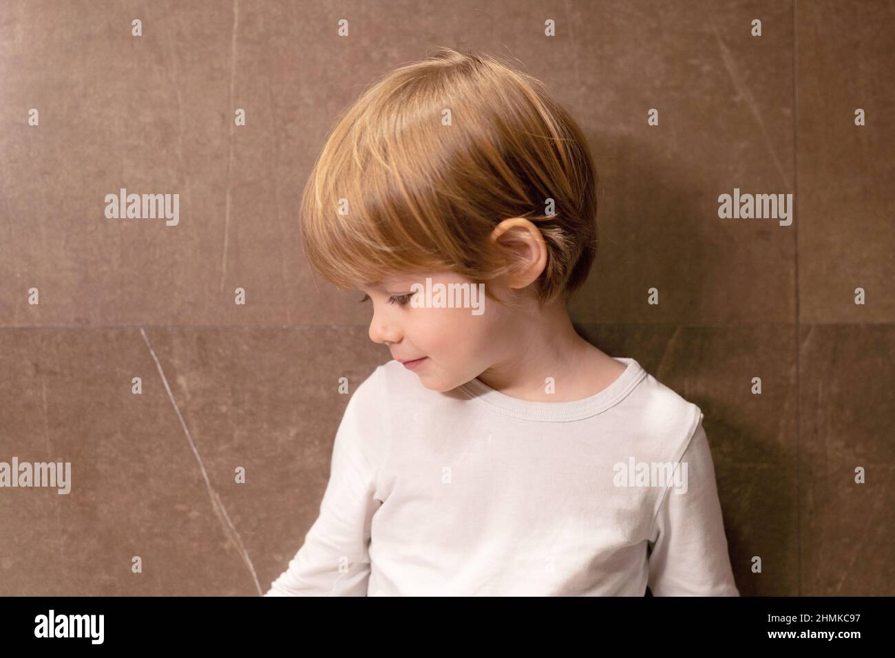 Profile side portrait little kid boy in bathroom Stock Photo - Alamy