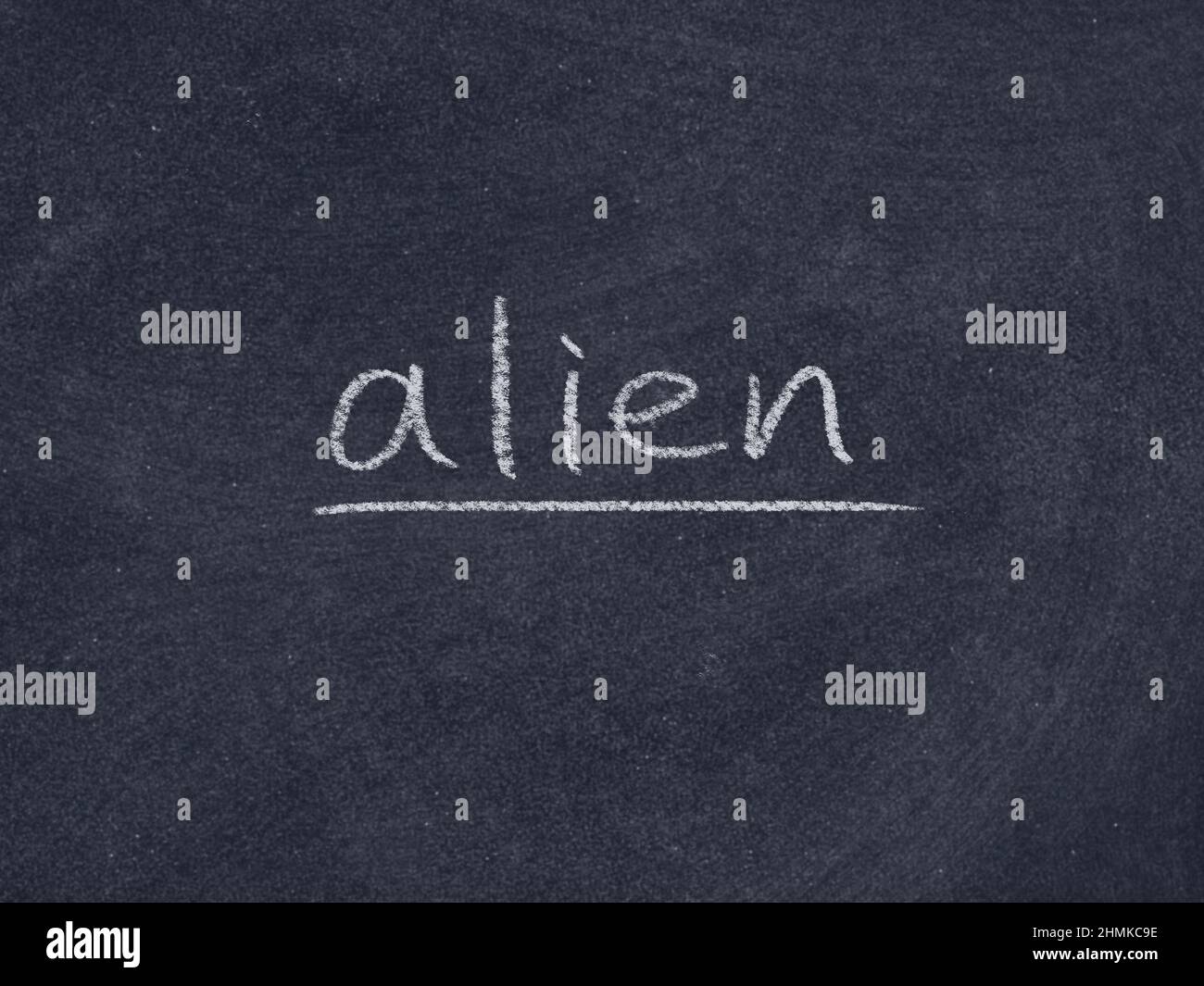 alien concept word on blackboard background Stock Photo - Alamy
