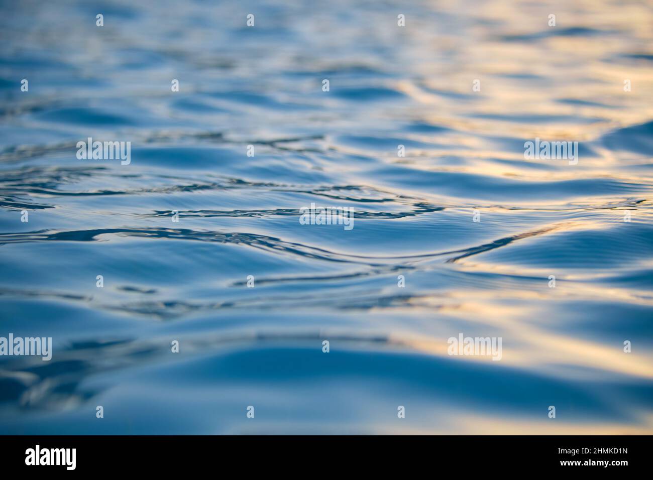 Closeup seascape surface of blue sea water with small ripple waves ...