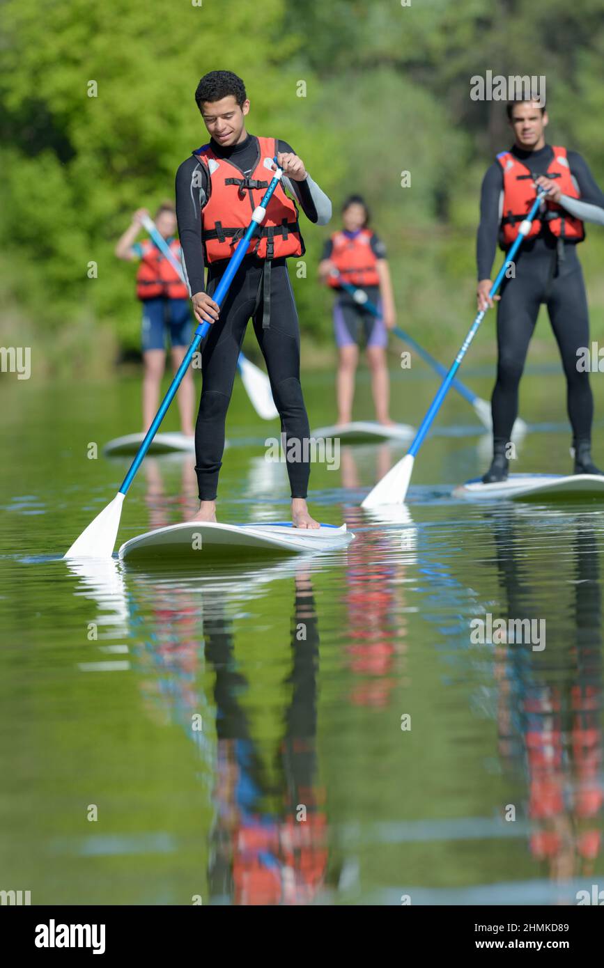 people stand up paddle boarding Stock Photo - Alamy