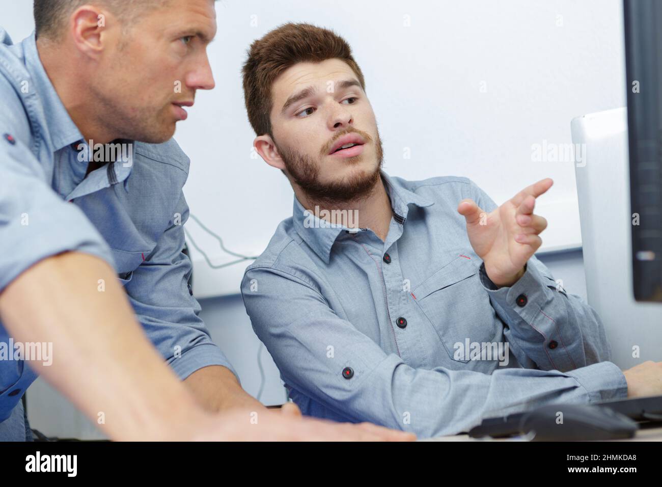 Two male assistants hi-res stock photography and images - Alamy