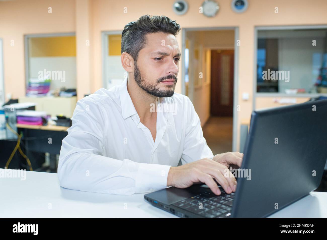 Coding man thinking laptop hi-res stock photography and images - Alamy