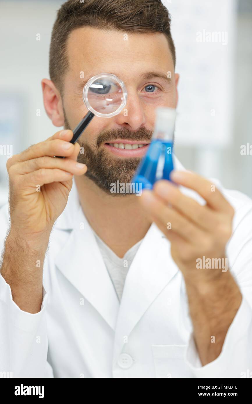 doctor draws his eye close up with a magnifying glass Stock Photo - Alamy