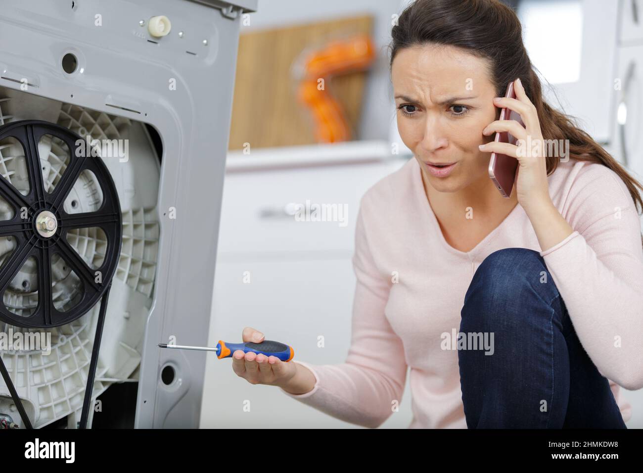 Plumber using phone hi-res stock photography and images - Alamy