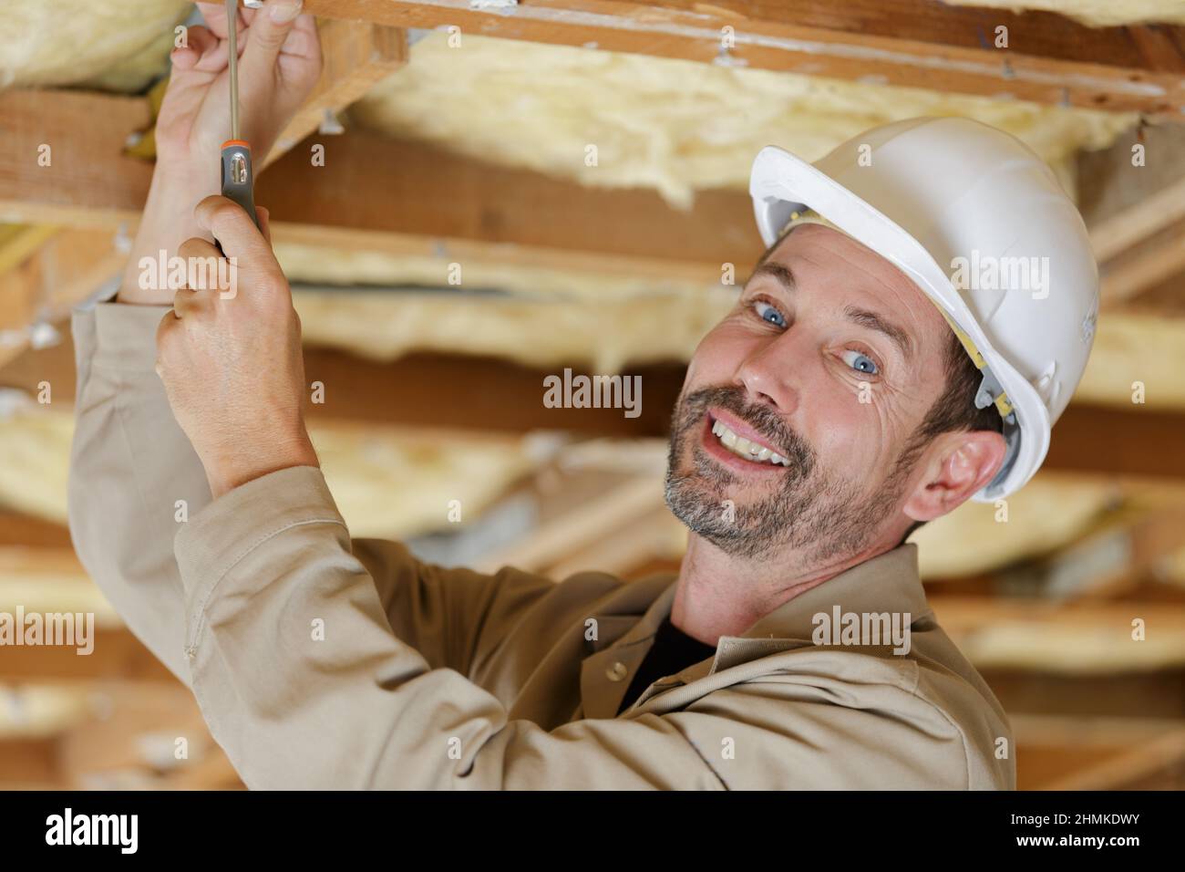 male builder screws the bolt Stock Photo - Alamy