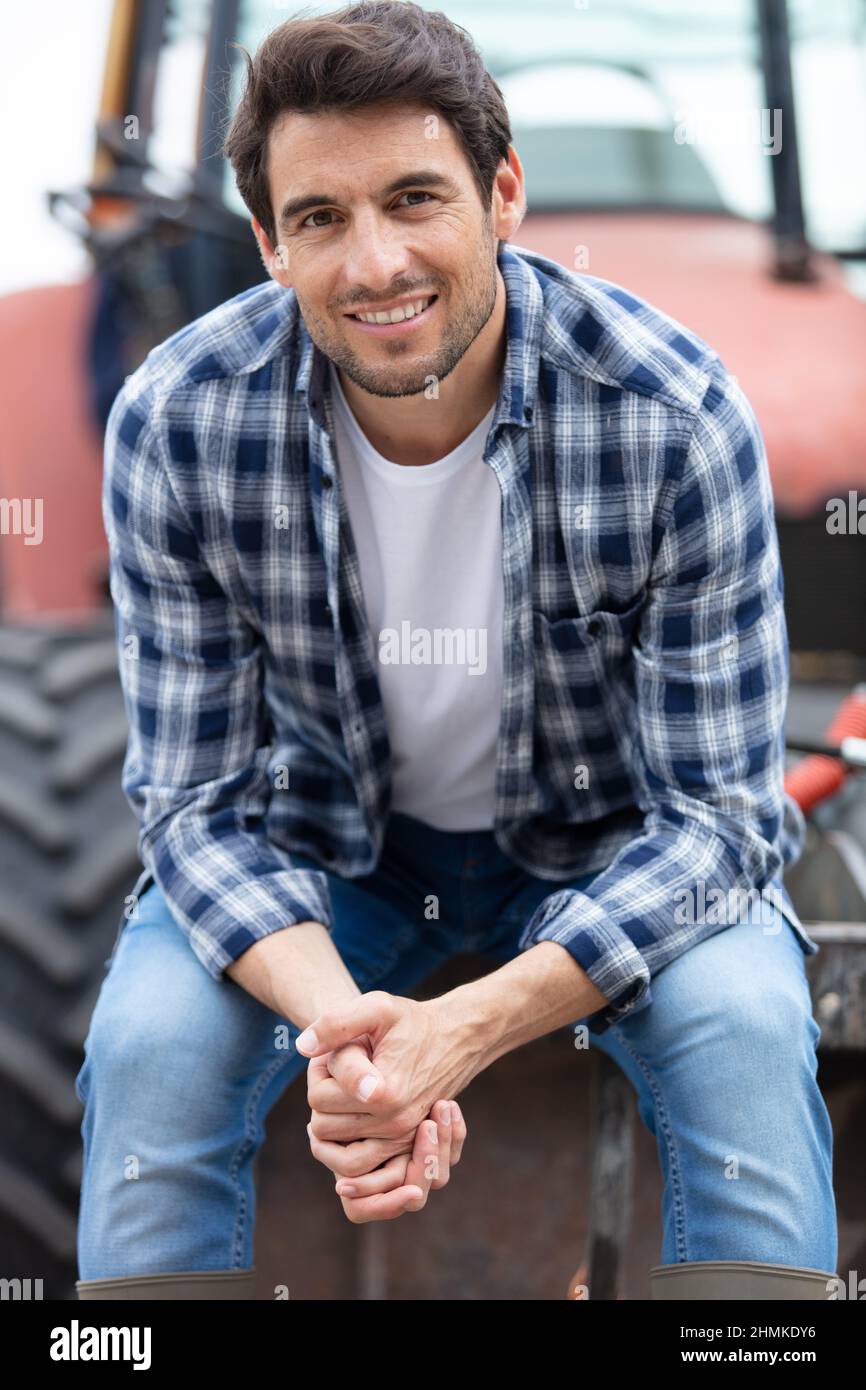 Farmer sitting on a tractor hi-res stock photography and images - Alamy
