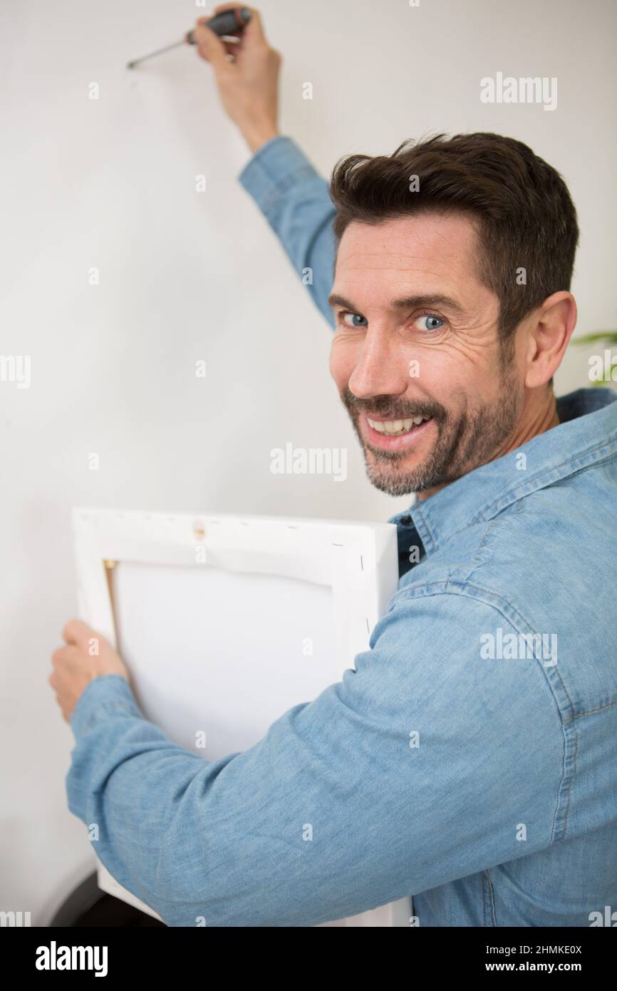 Hammer man wall hanging hi-res stock photography and images - Alamy